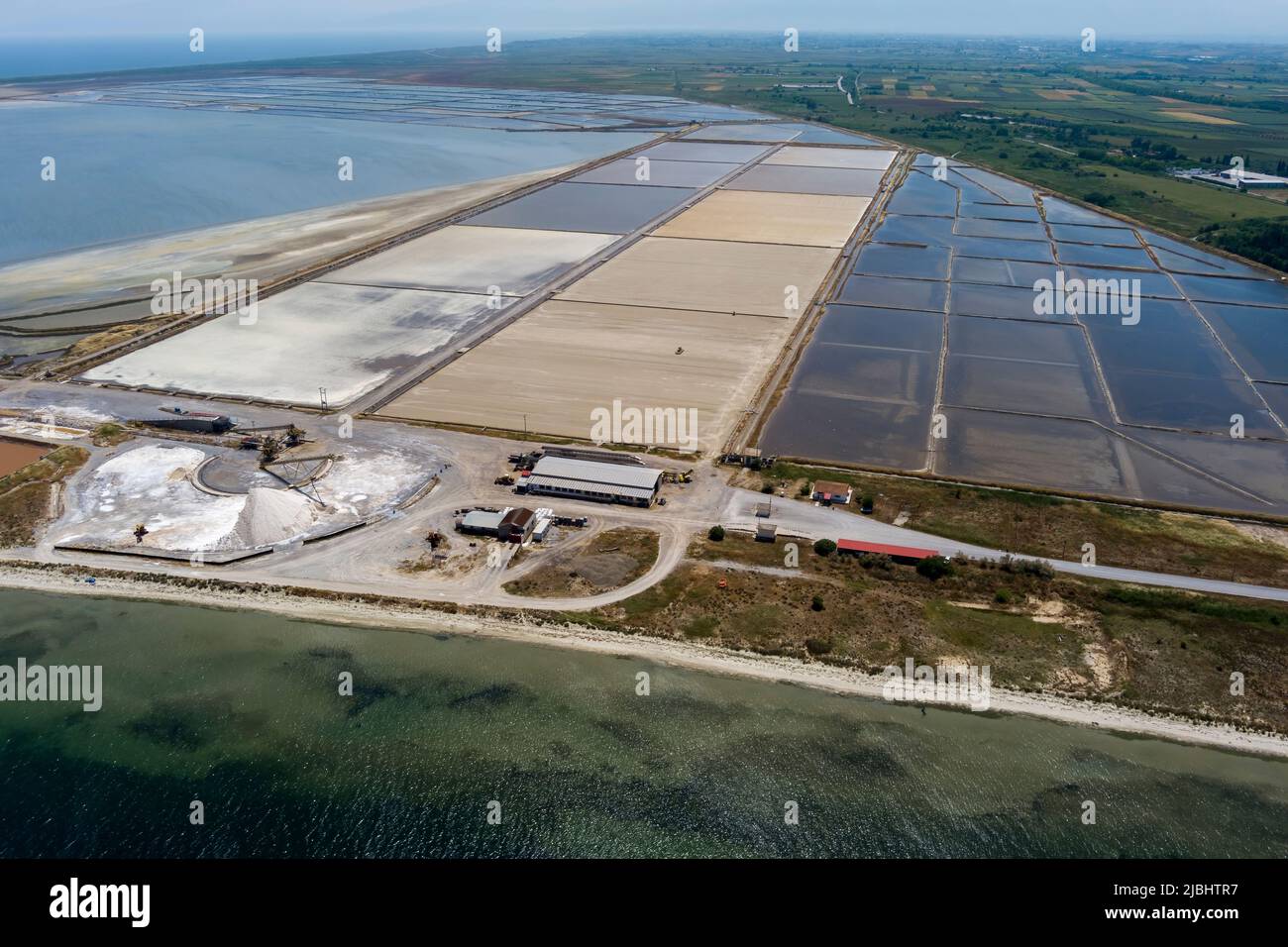 Aerial view of salt evaporation ponds and salt mounds these ponds are ...