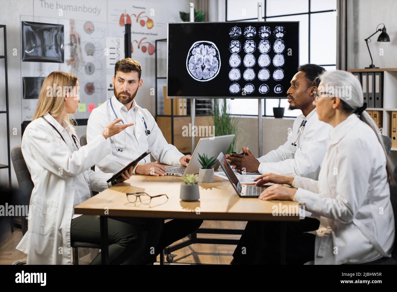 International medical team having meeting in conference room at modern ...