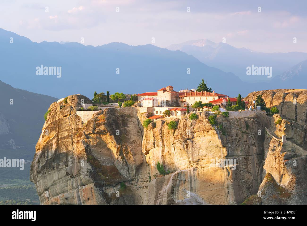 Stone monastery in the mountains. Kalabaka, Greece summer cloudy day in ...