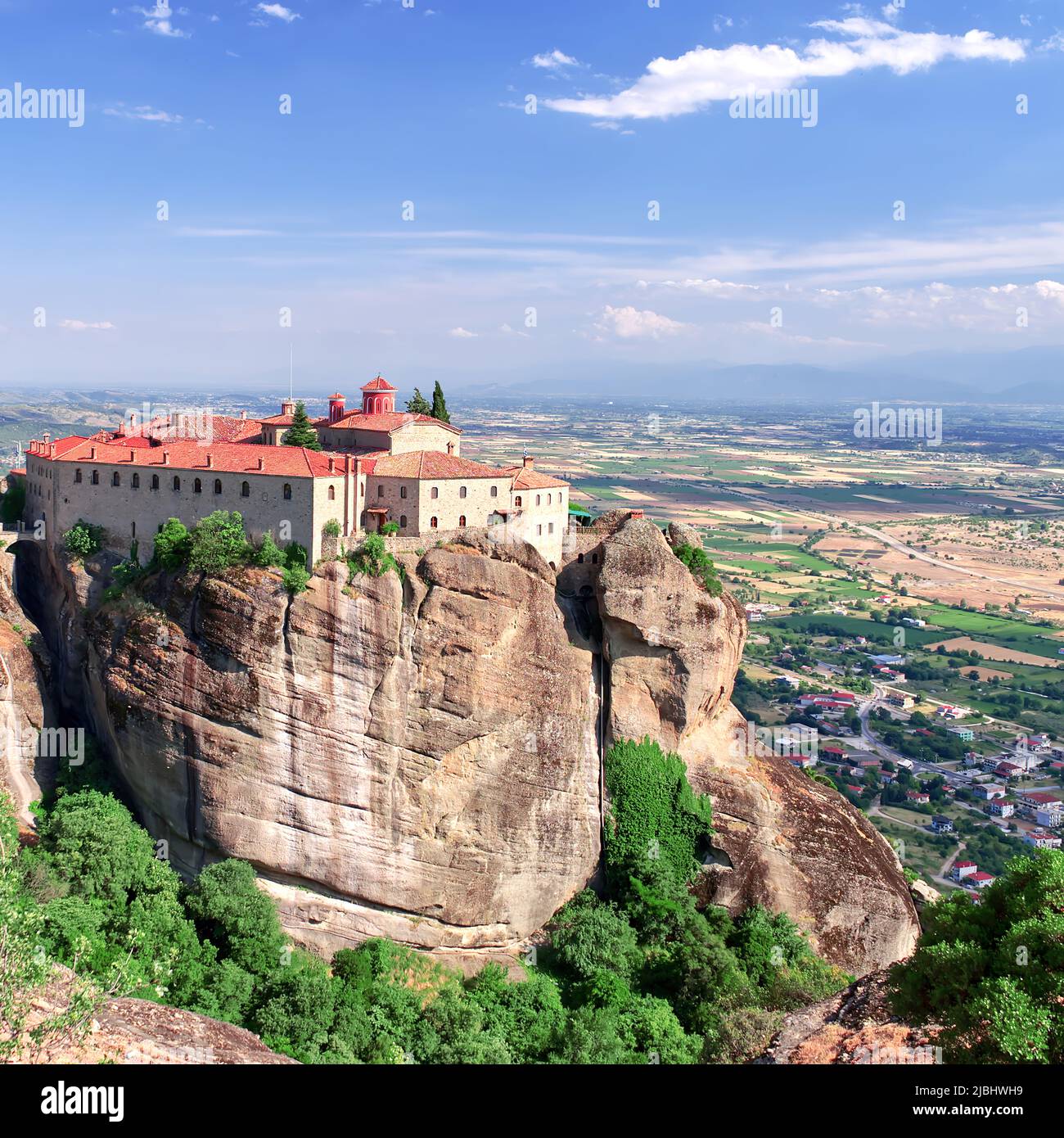 Stone monastery in the mountains. Kalabaka, Greece summer cloudy day in ...