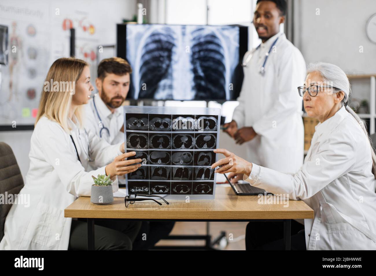 Qualified international doctors of differents ages gathering at ...