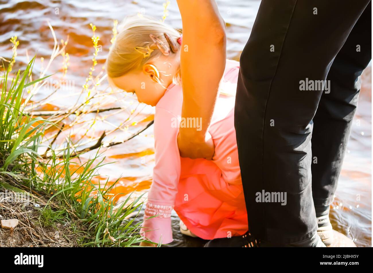 Father and daughter spending time in a spring park Stock Photo - Alamy