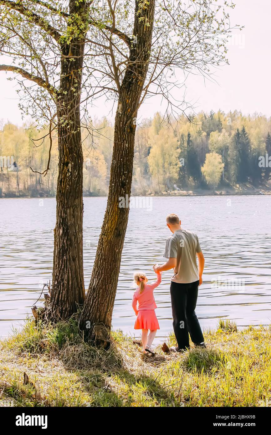 Father and daughter spending time in a spring park Stock Photo - Alamy