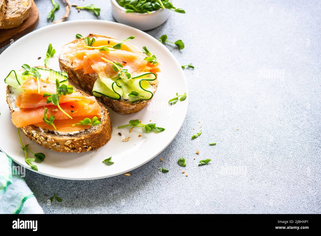 Open sandwich with cream cheese, salmon and cucumber Stock Photo - Alamy