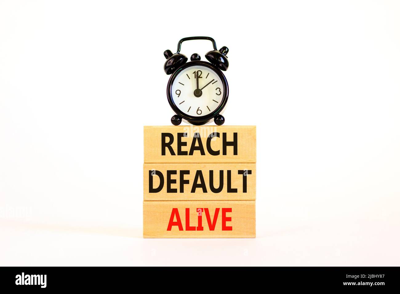 Reach default alive symbol. Concept words Reach default alive on wooden ...