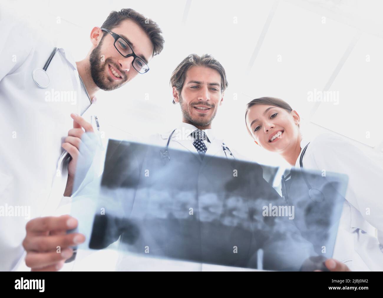 bottom view young group of doctors looking at x-ray Stock Photo - Alamy