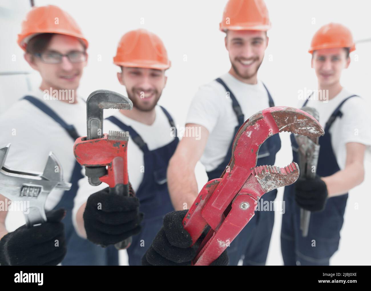 image of a group of builders with gas keys Stock Photo - Alamy