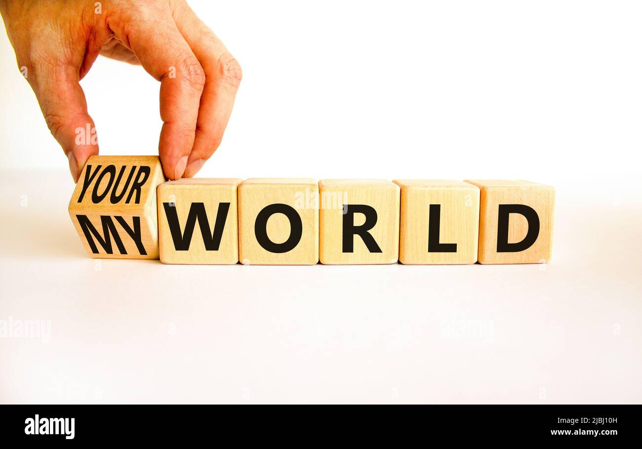 My or your world symbol. Businessman turns wooden cubes and changes ...