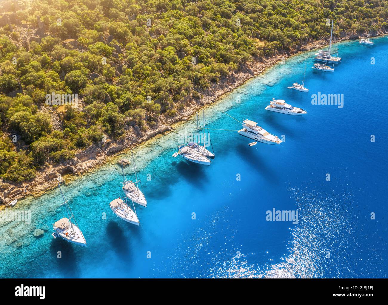Aerial view of beautiful yachts, boats on the sea bay at sunset Stock Photo - Alamy