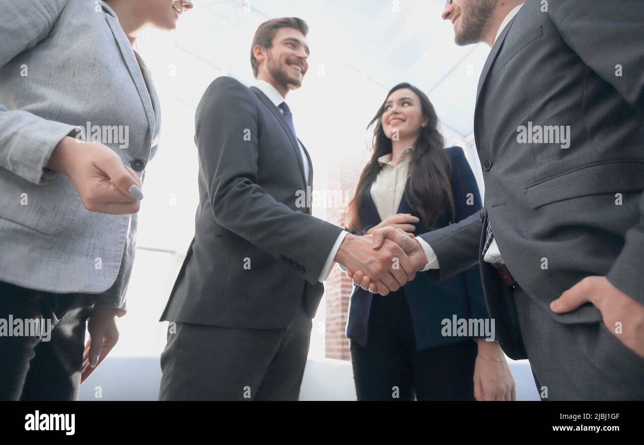 Handshake of successful businessmen greeting each other Stock Photo - Alamy