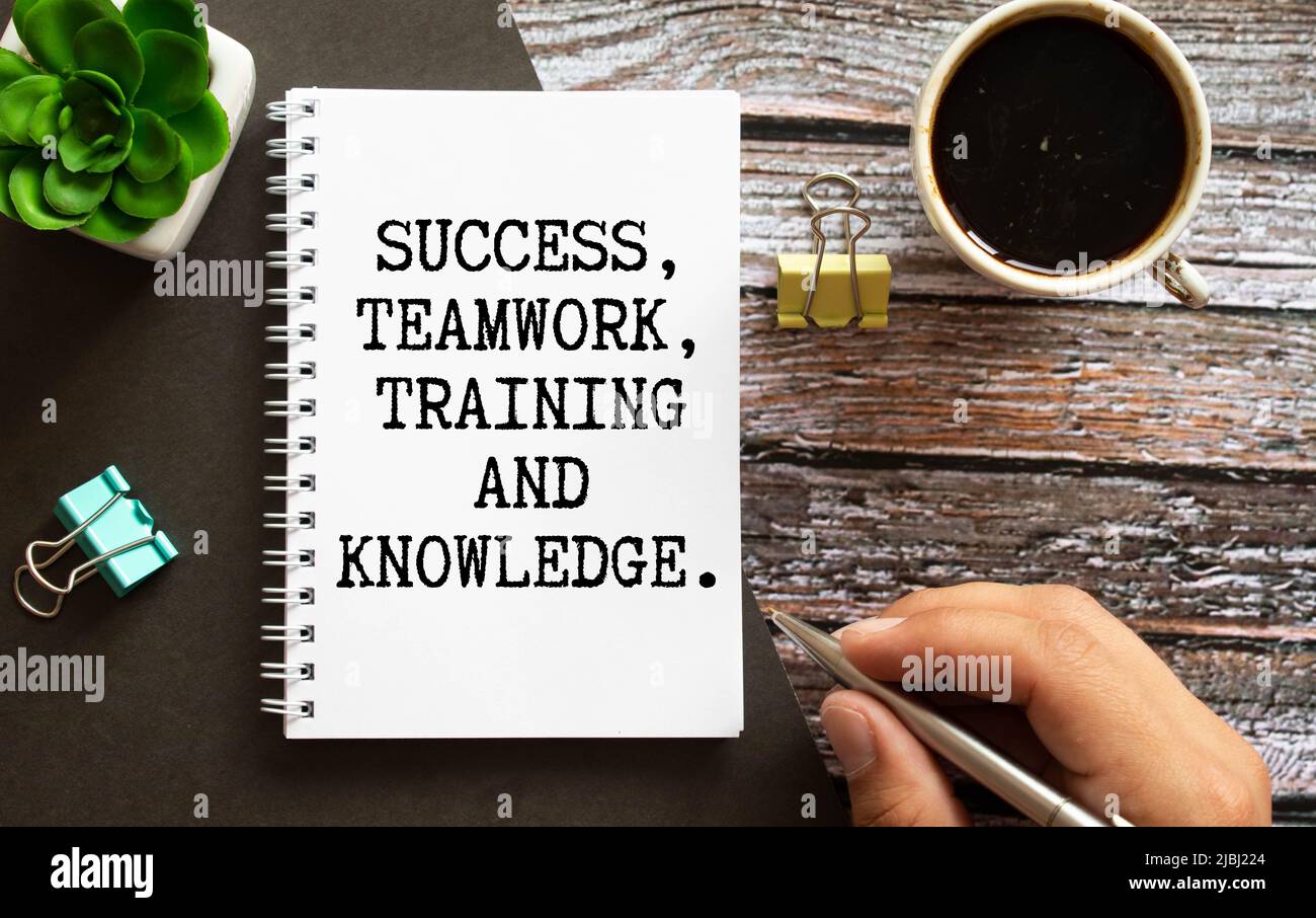 Notebook with the text Training and Development on the office table among the stationery Stock ...