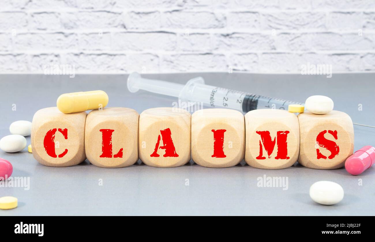 Claims Word In Wooden Cube Stock Photo - Alamy