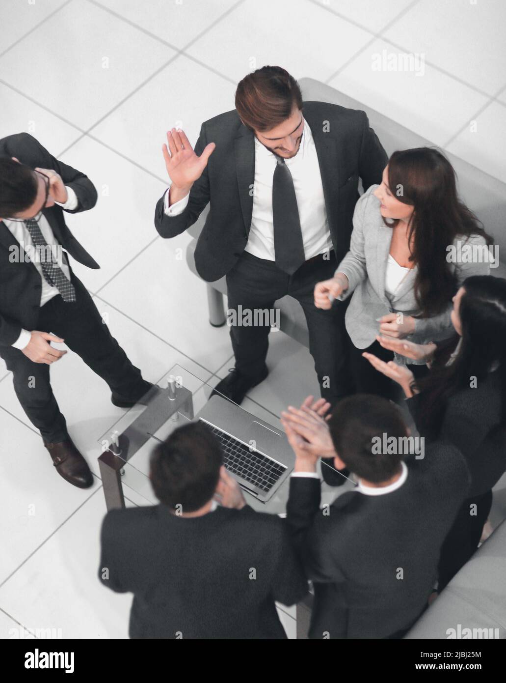 Happy successful business team giving a high fives gesture as th Stock ...