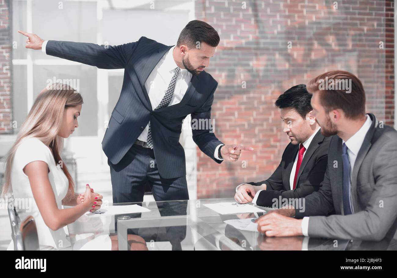 HR Manager talking to employees in the office Stock Photo - Alamy