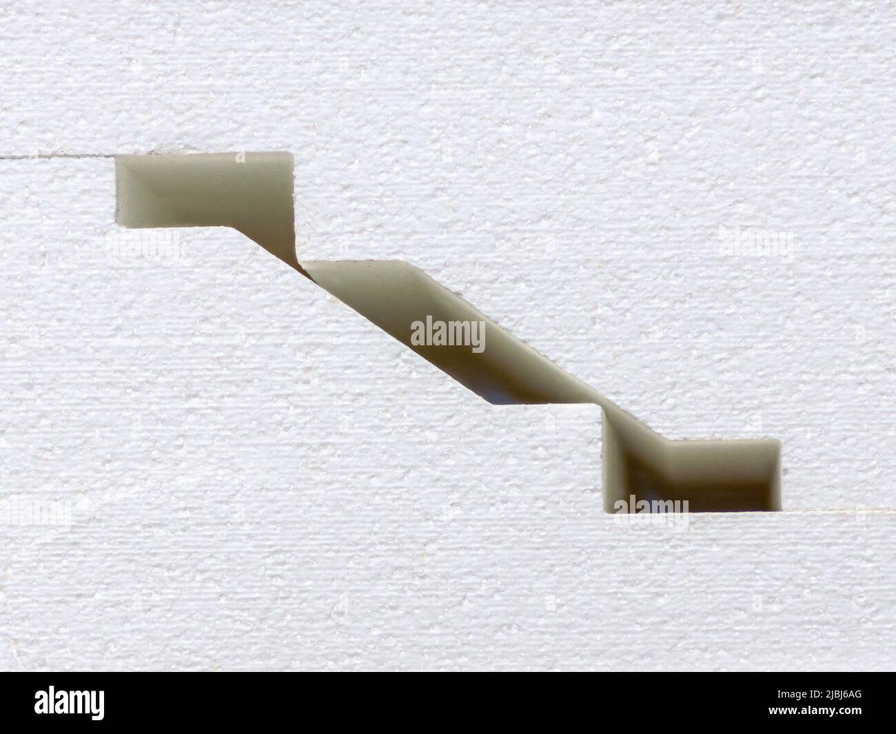 white blocks of a complex profile lie in stacks - close-up and ...