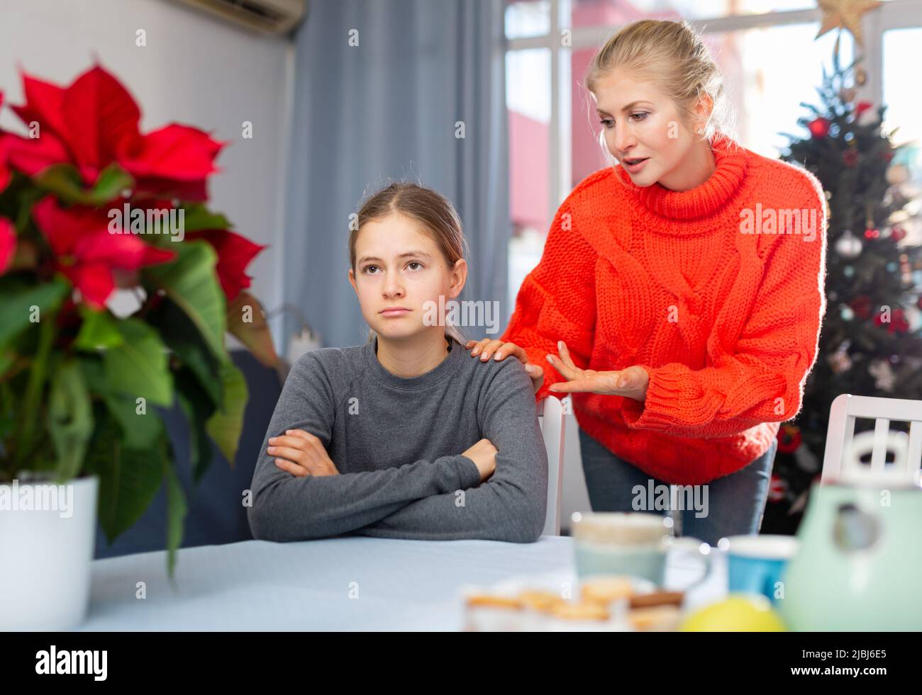 Teenage girl ignoring her mother before Christmas Stock Photo - Alamy