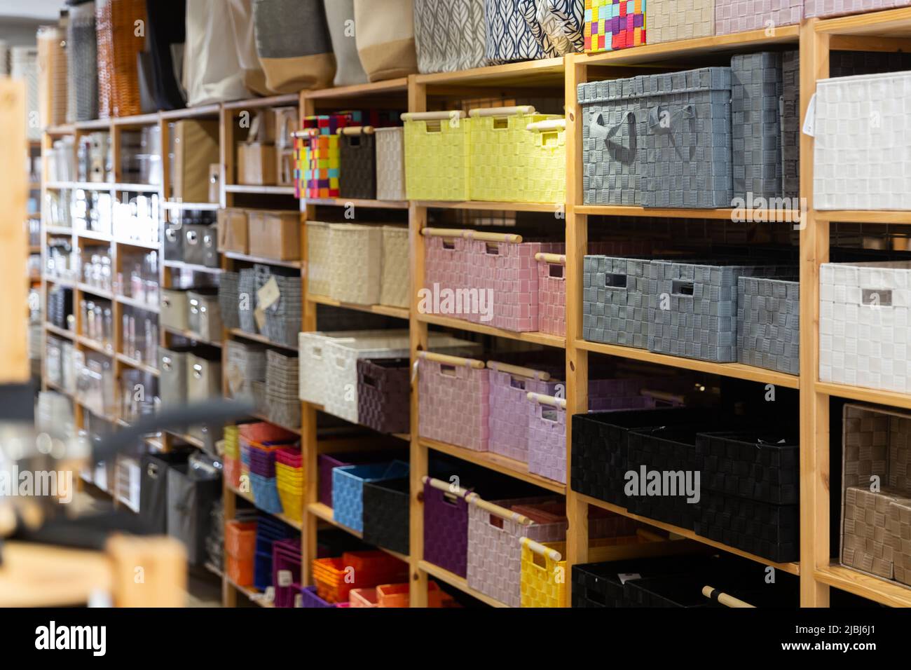 Storage boxes on shelves at furnishings store Stock Photo - Alamy