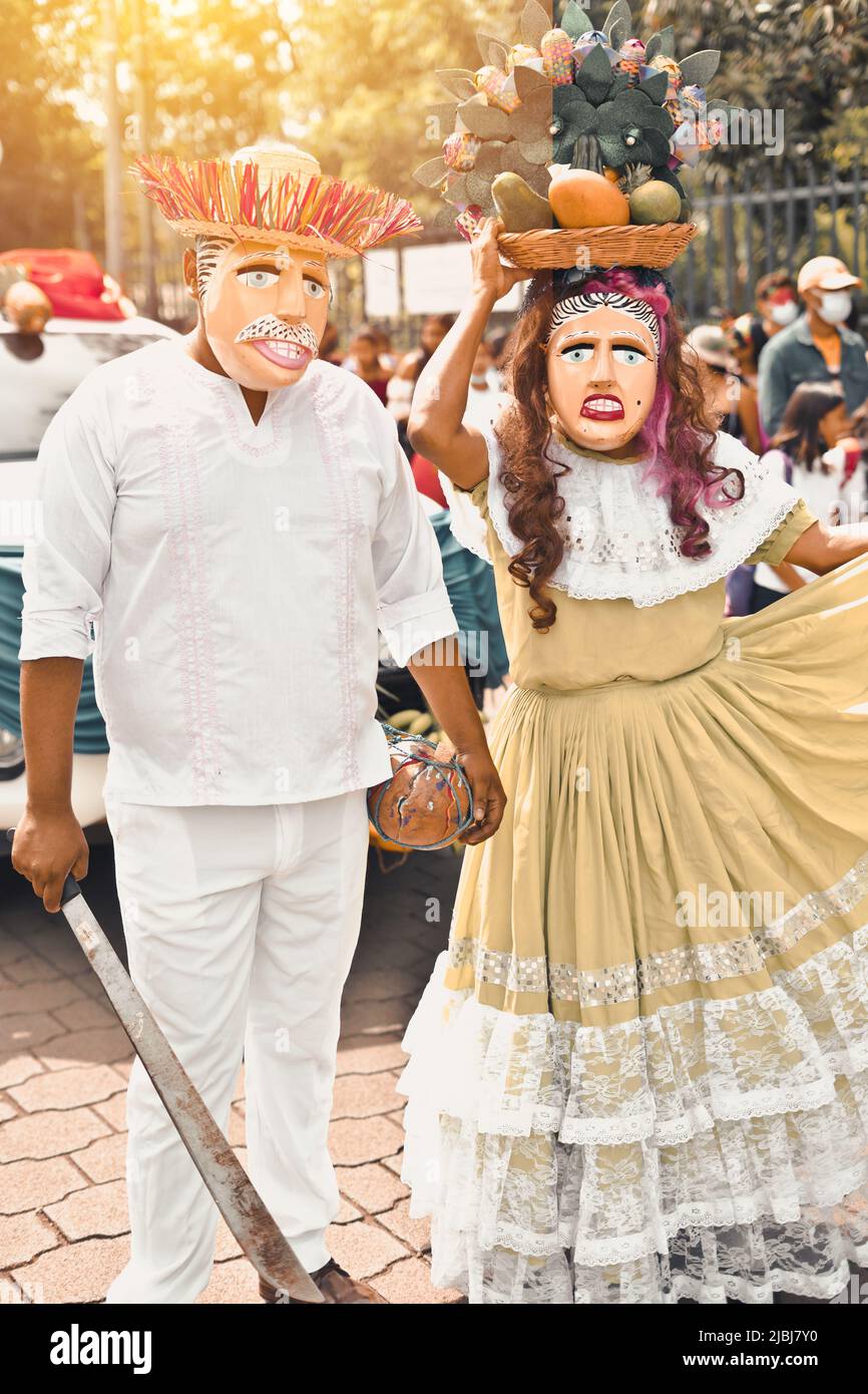 Man and woman with costumes of El Viejo and La Vieja, a traditional ...