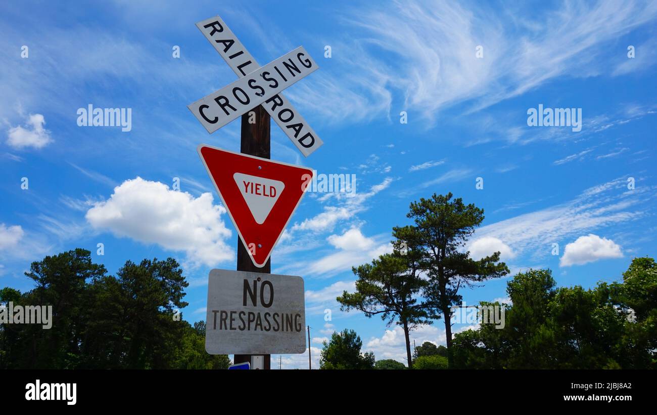 traffic/limit signs on railroad crossing Stock Photo - Alamy
