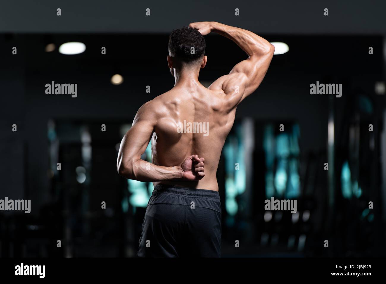 Portrait Of A Young Physically Fit Man Showing His Well Trained Body ...