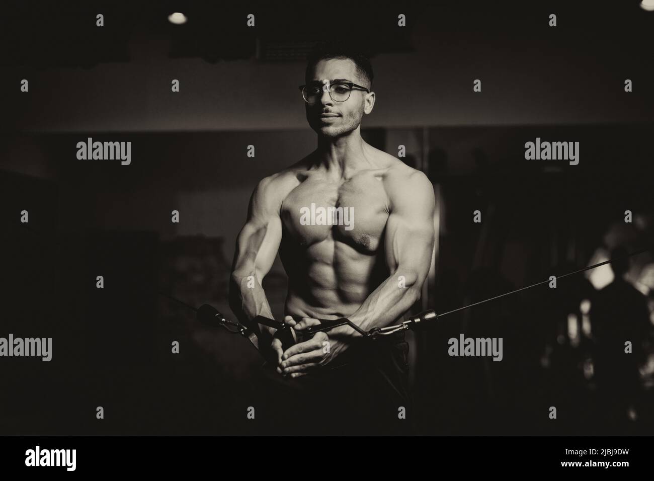 Athlete With Gynecomastia Breasts Problem Working Out Chest On Machine ...