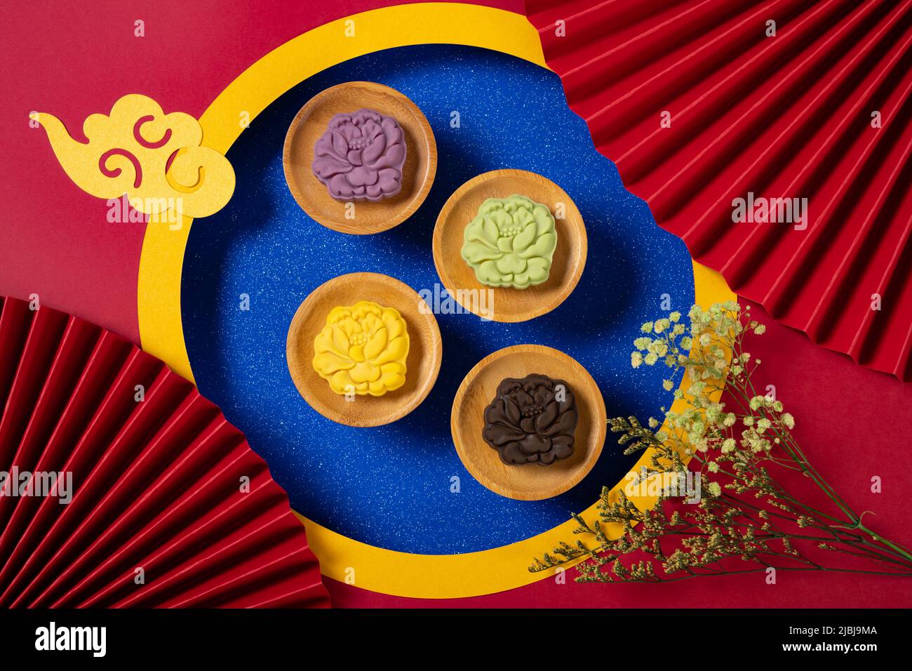 colorful flower shape snowy mooncakes with Chinese decorations Stock ...