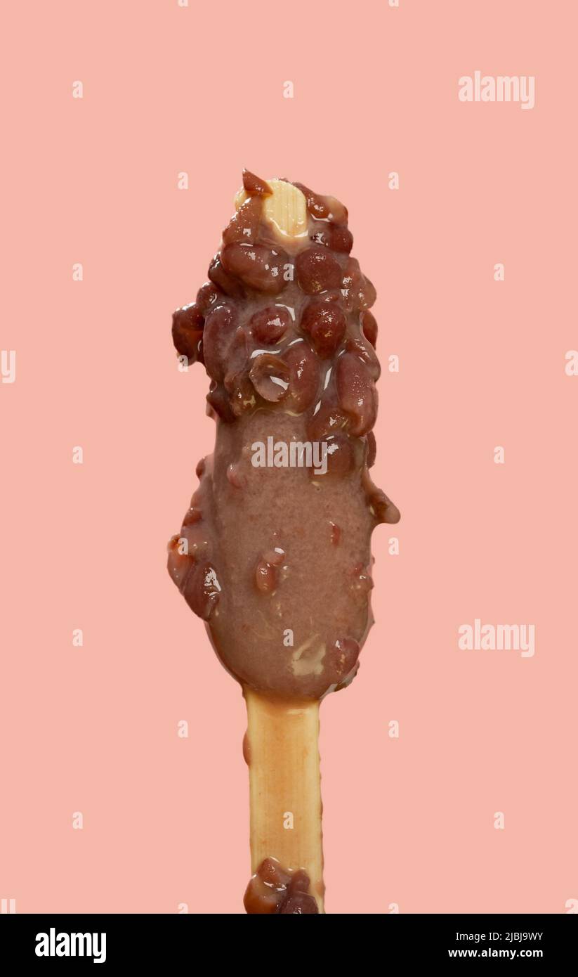 mostly melted red bean popsicle on pink background Stock Photo - Alamy
