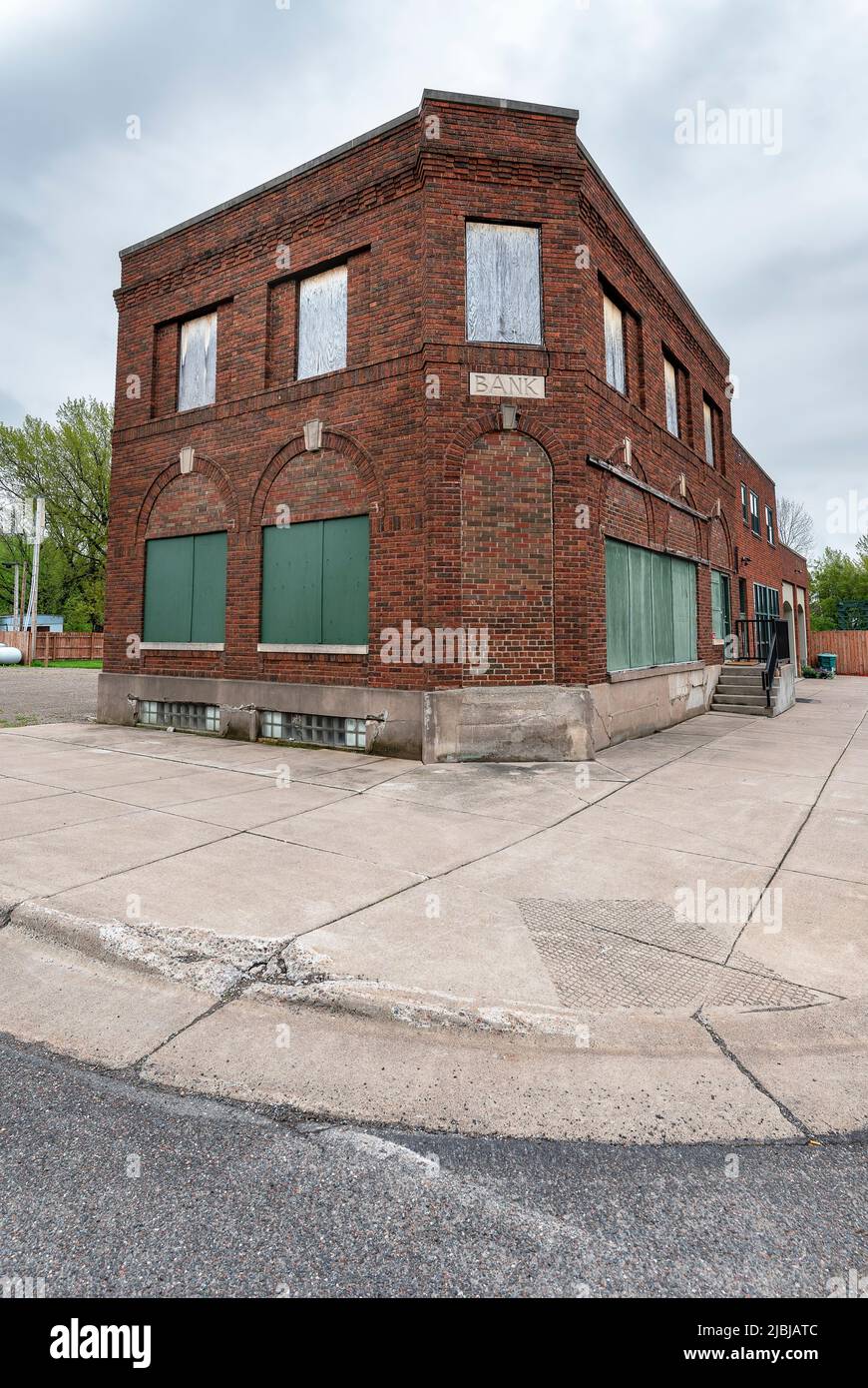 Exterior of an old abandoned brick bank building in the village of ...