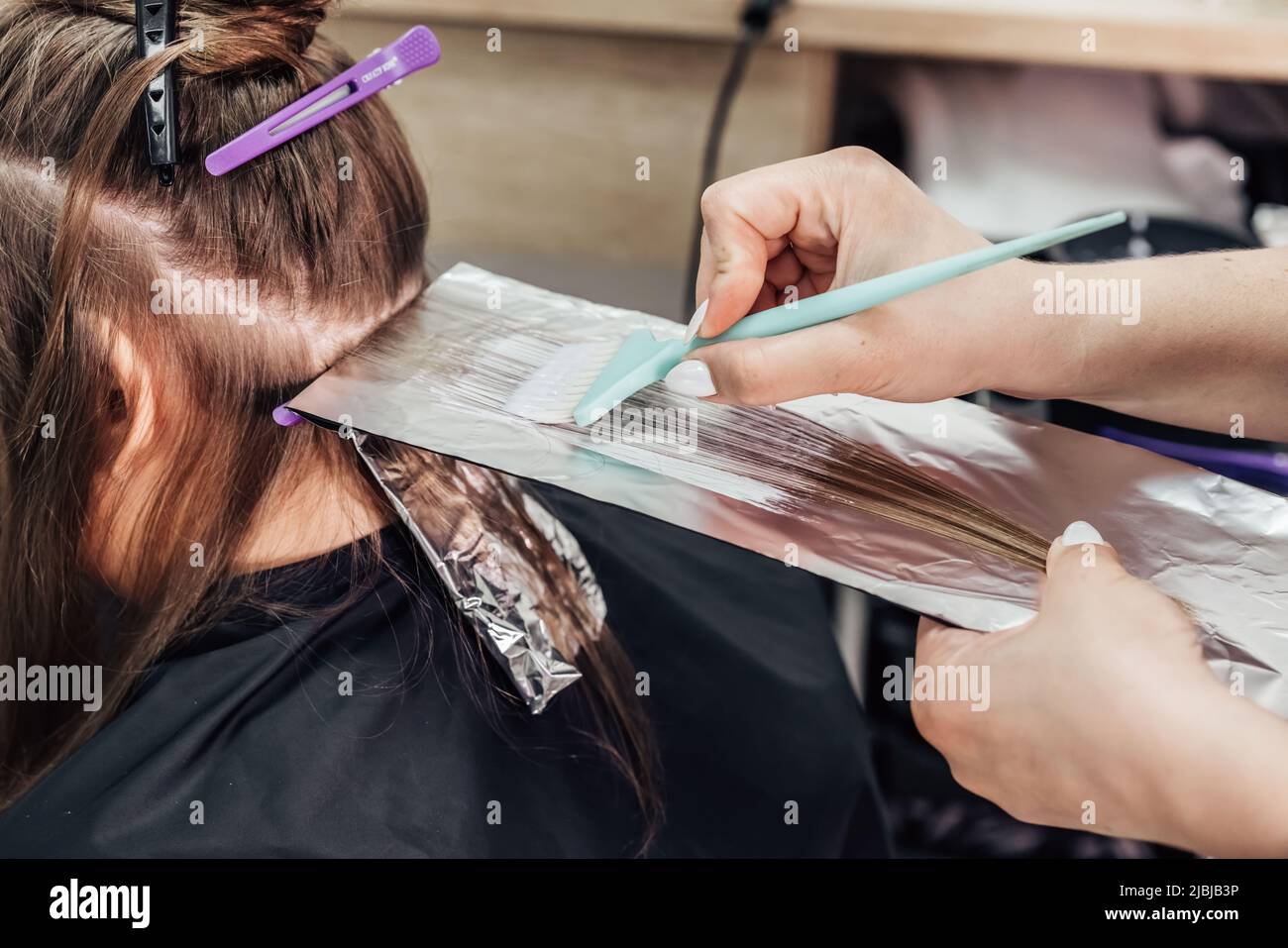 Woman dying hair with gloves hi-res stock photography and images - Alamy