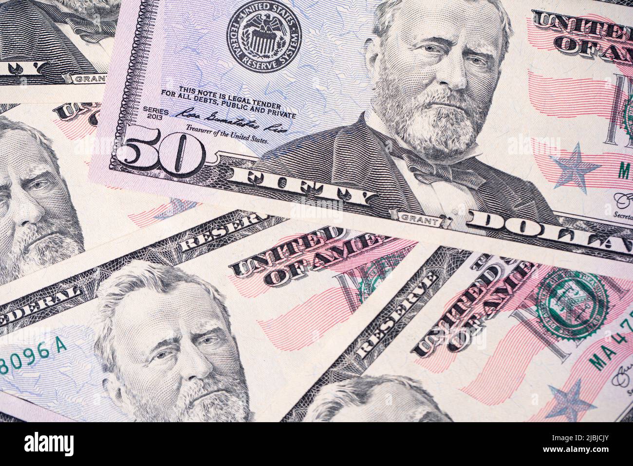 Fifty dollar bills closeup, spread out paper banknotes. President Grant ...