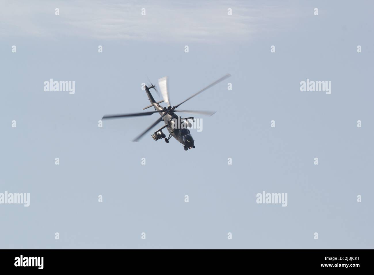 29 AUGUST 2019 MOSCOW, RUSSIA: A military dark helicopter flying in the ...