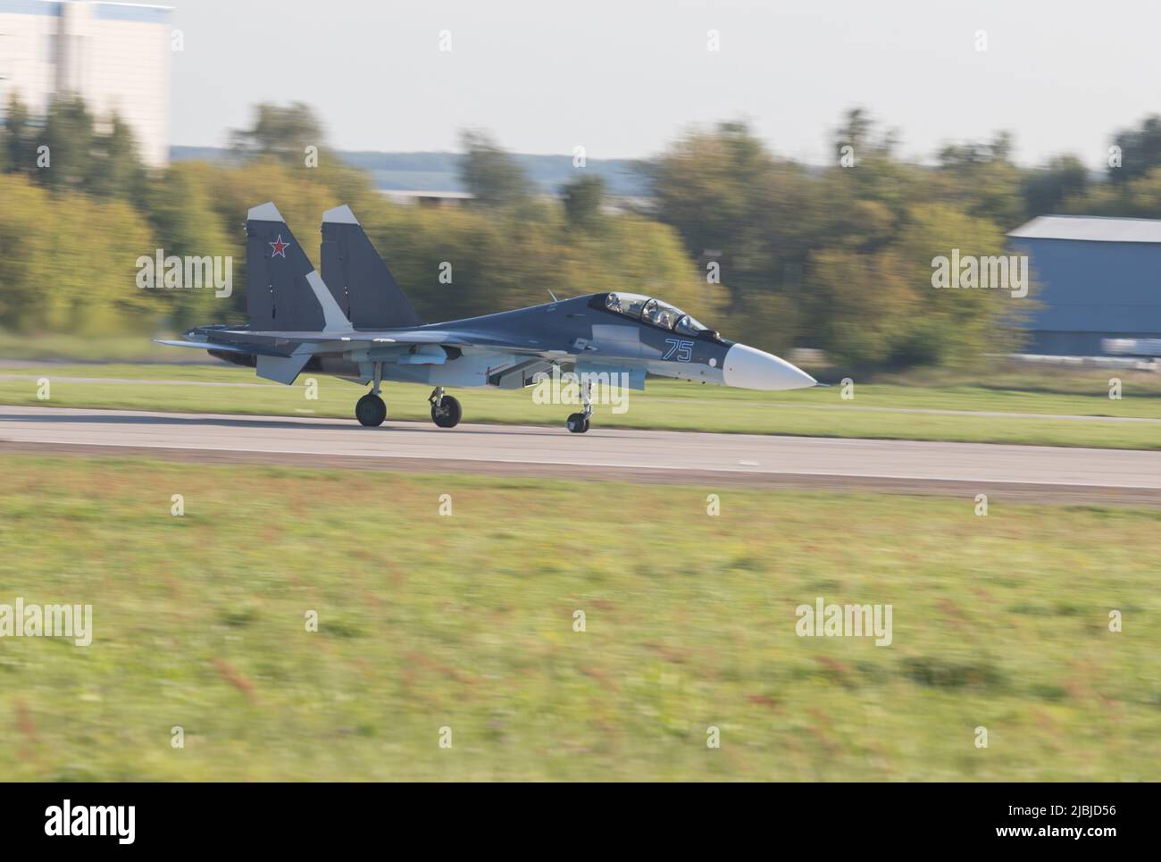 Plane gaining speed on runway hi-res stock photography and images - Alamy