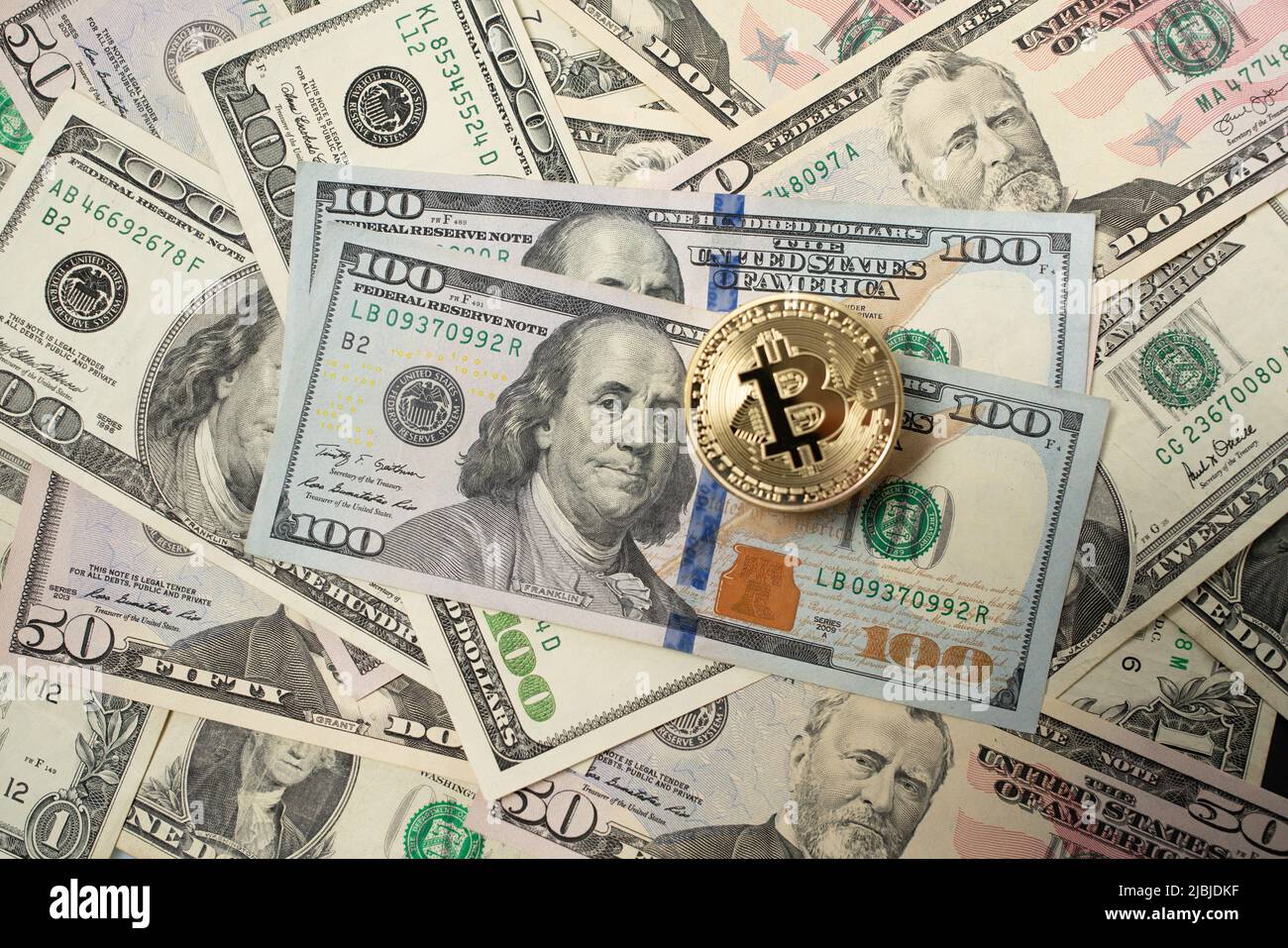 Bitcoin Crypto currency with US dollar banknotes. Crypto coins and 100 ...