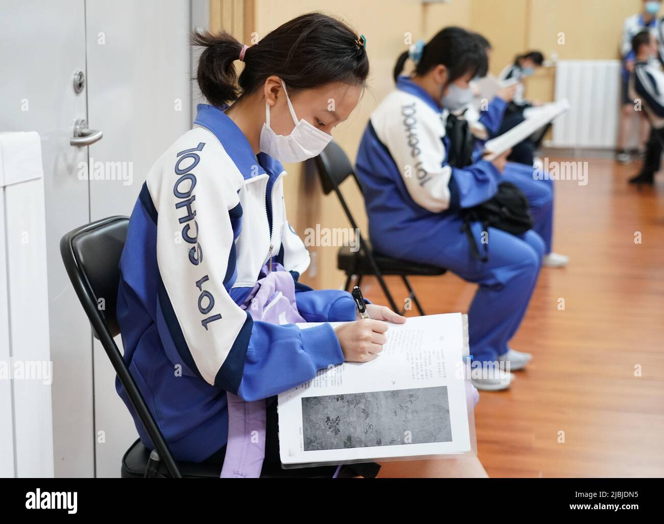 Beijing, China. 7th June, 2022. Examinees review before exam at an exam ...