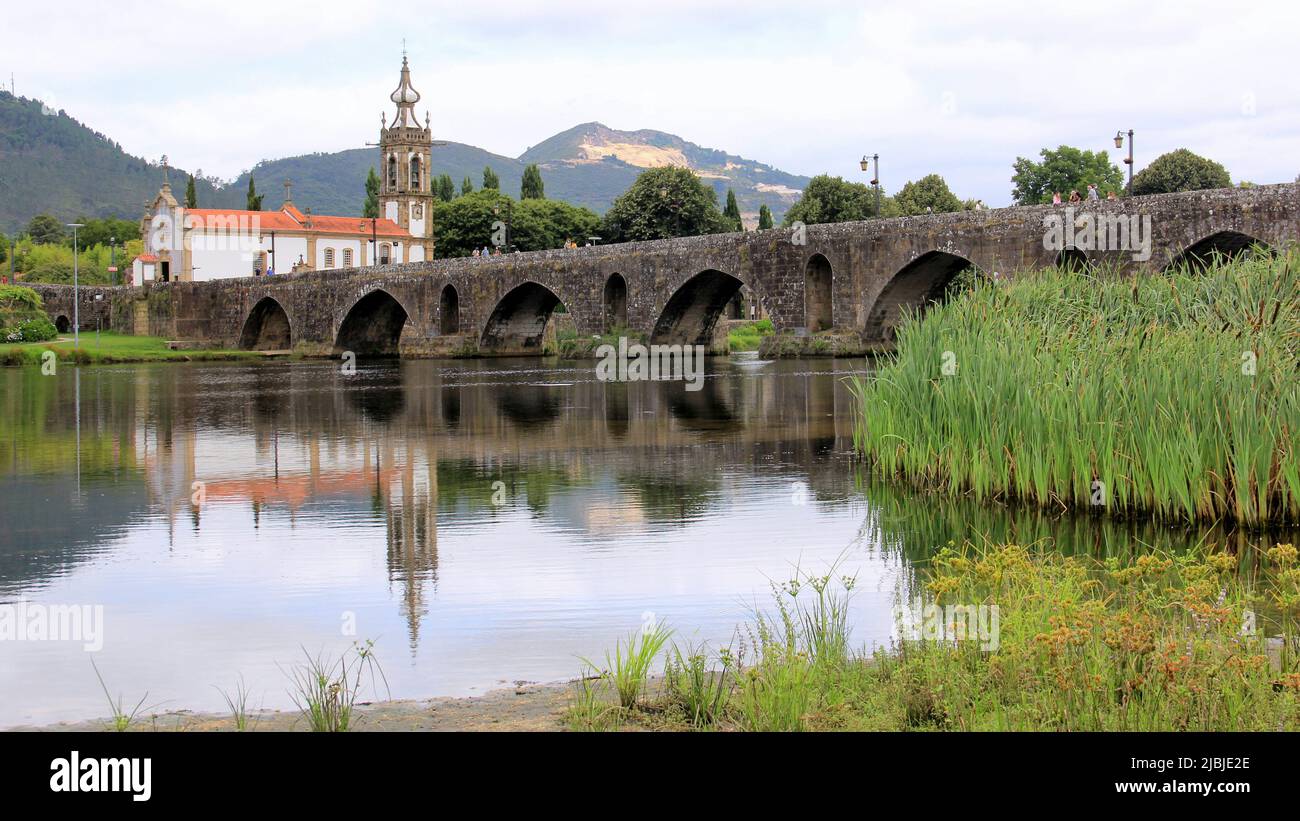 Medieval stone bridge over the Lima River, 18th-century Church of Santo ...