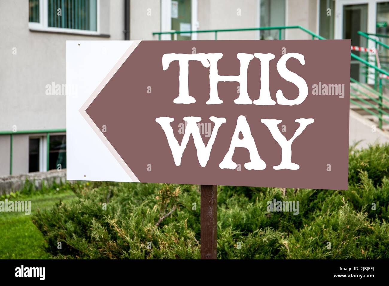 This Way. Road sign, directions arrow in the urban environment Stock ...