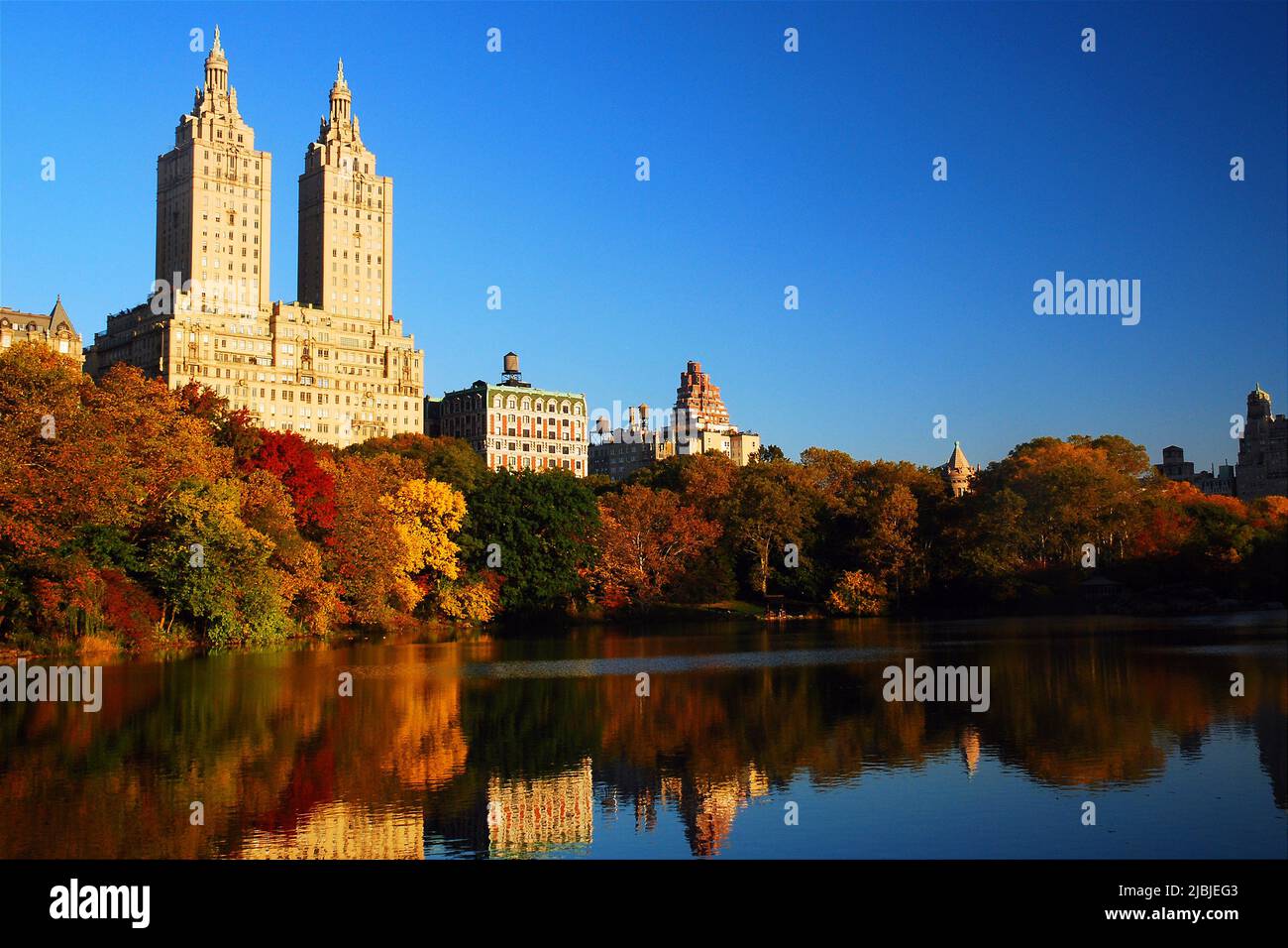 The San Remo Apartments rise over the autumn colors and fall foliage of ...
