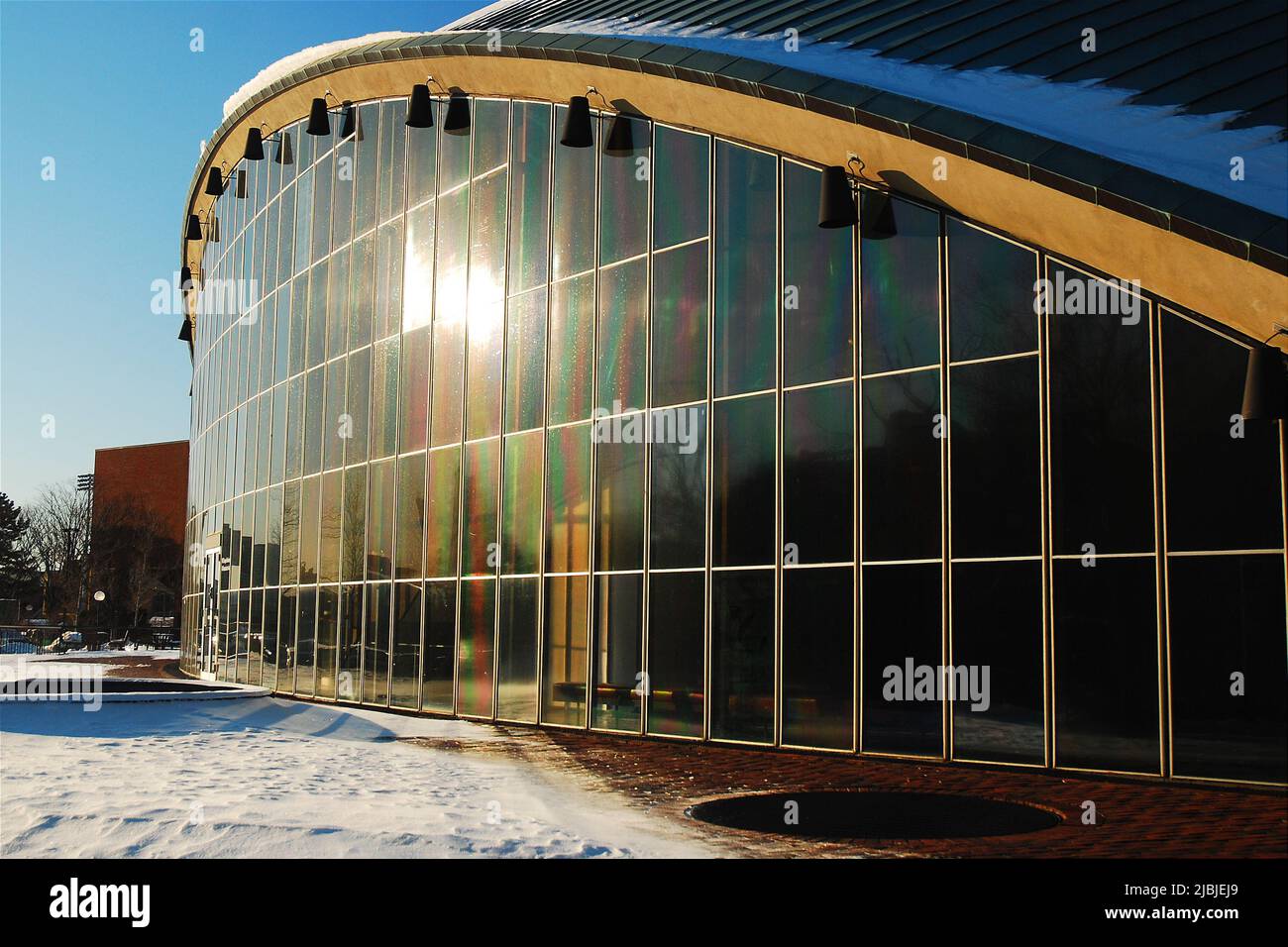 The glass curtain wall reflects the sunlight on the Kresge Auditorium ...