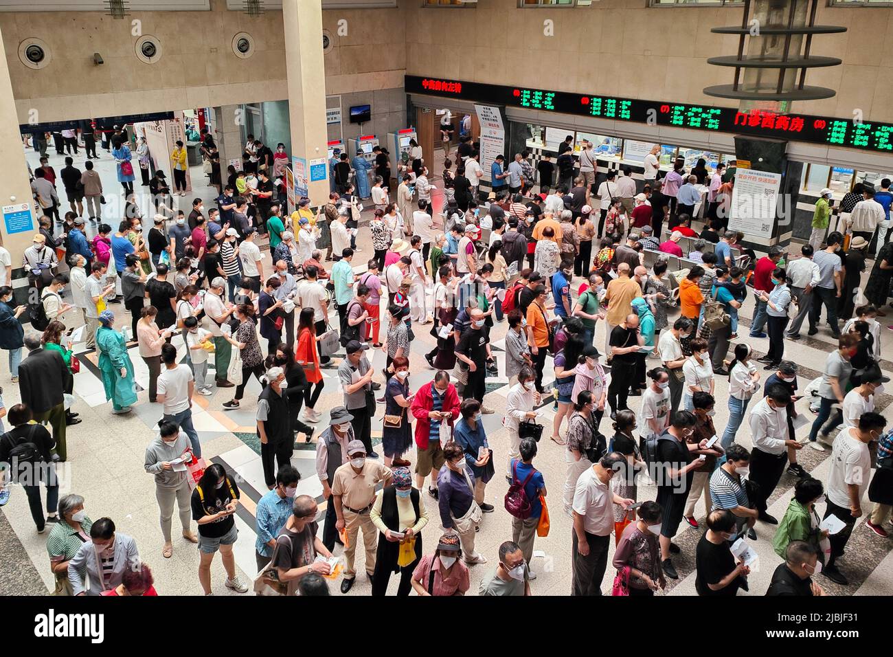 SHANGHAI, CHINA - JUNE 7, 2022 - People queue up at the registration ...