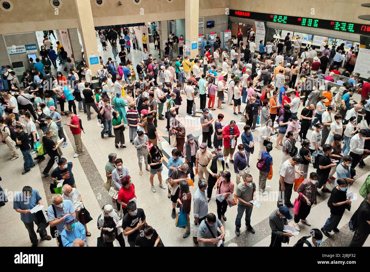 SHANGHAI, CHINA - JUNE 7, 2022 - People queue up at the registration ...