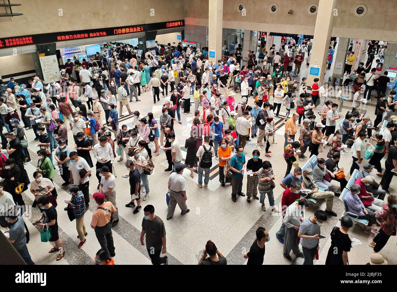 SHANGHAI, CHINA - JUNE 7, 2022 - People queue up at the registration ...