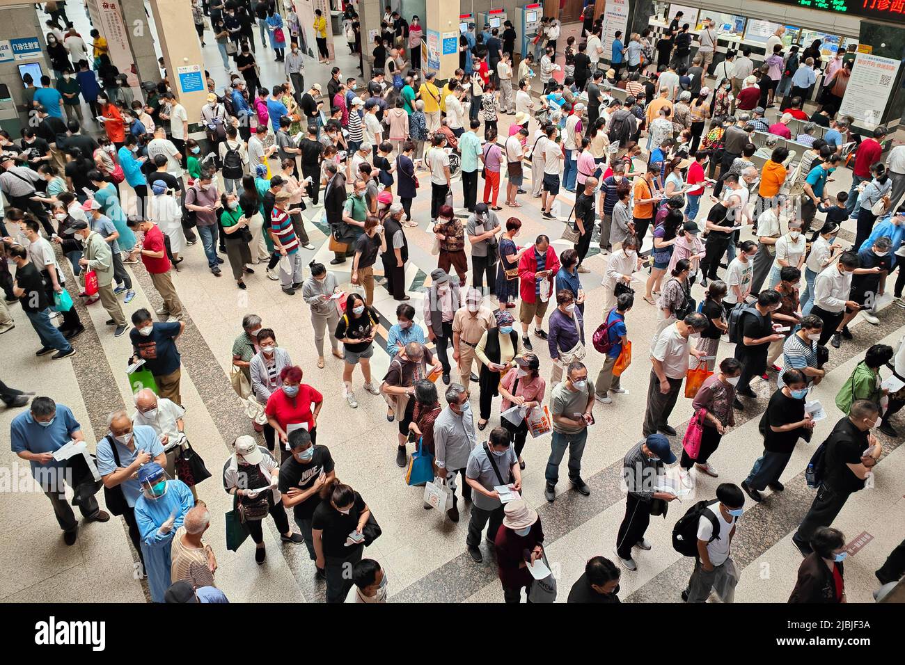 SHANGHAI, CHINA - JUNE 7, 2022 - People queue up at the registration ...