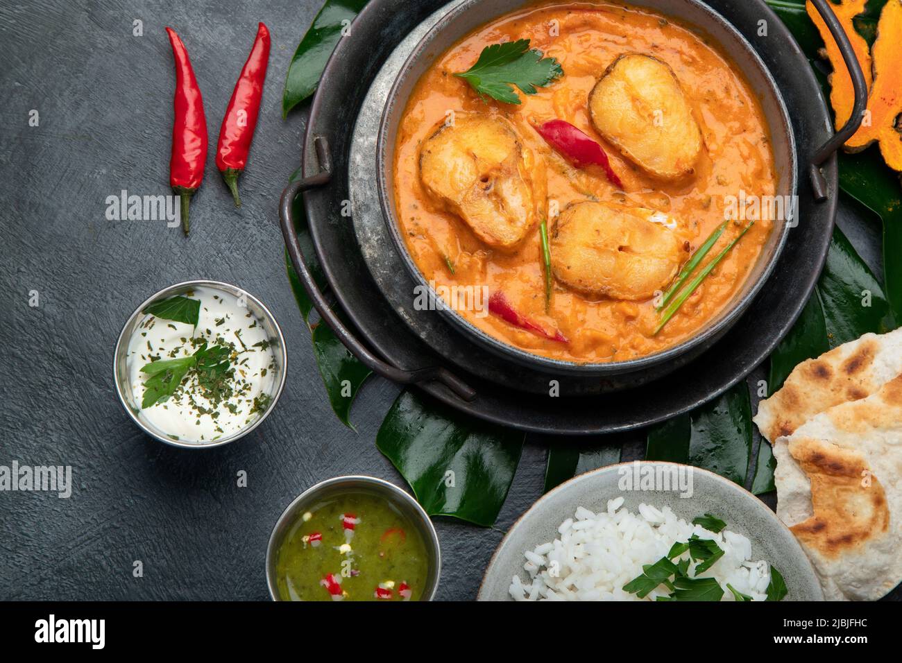Kerala fish curry on dark background. Traditional food concept. Top ...