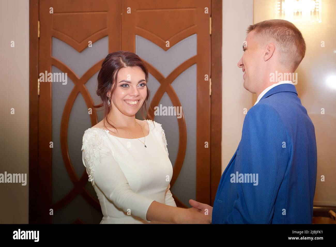 The bride and groom during beautiful marriage ceremony at registry ...