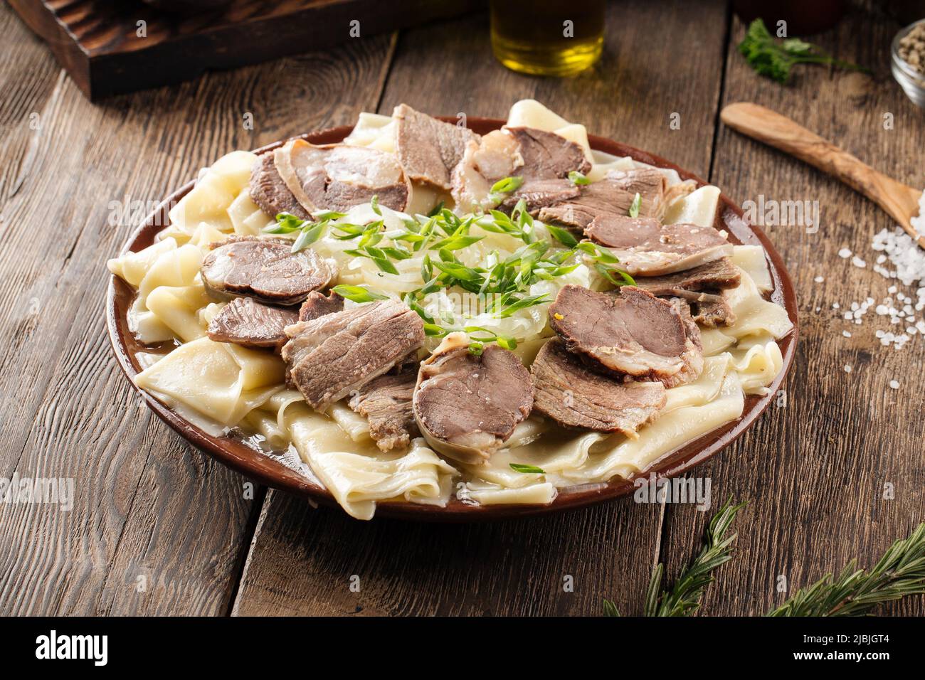 Kazakh national dish beshbarmak with horse meat Stock Photo - Alamy