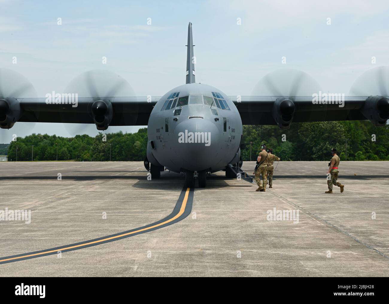 Airmen assigned to the 19th Airlift Wing conduct a pre-flight check of ...