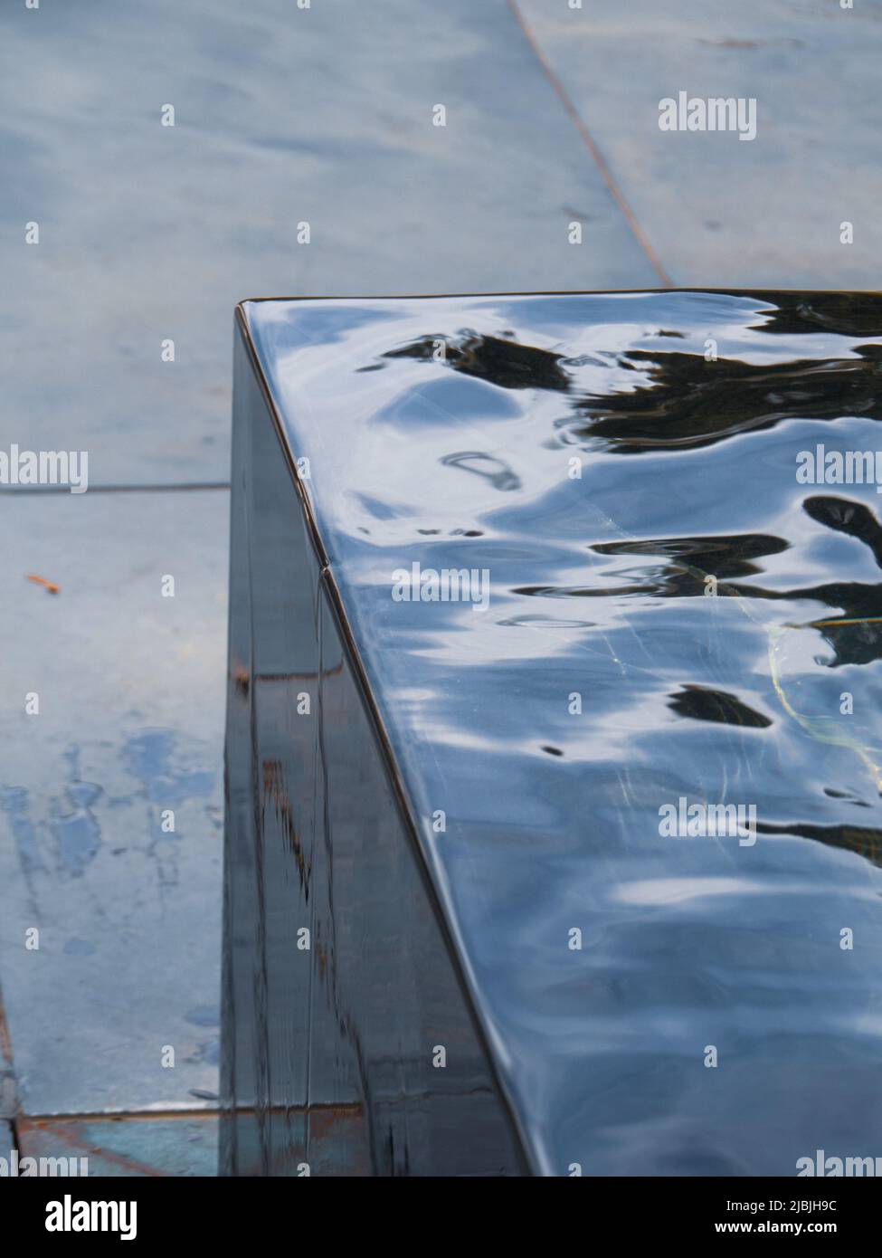 Shapes and texture, the corner of a water feature, shiny water surface ...