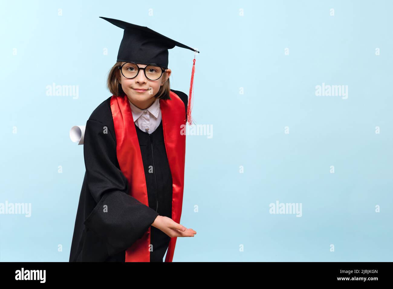 Whizz kid 9-11 year girl wearing graduation cap, round eyewear and ...