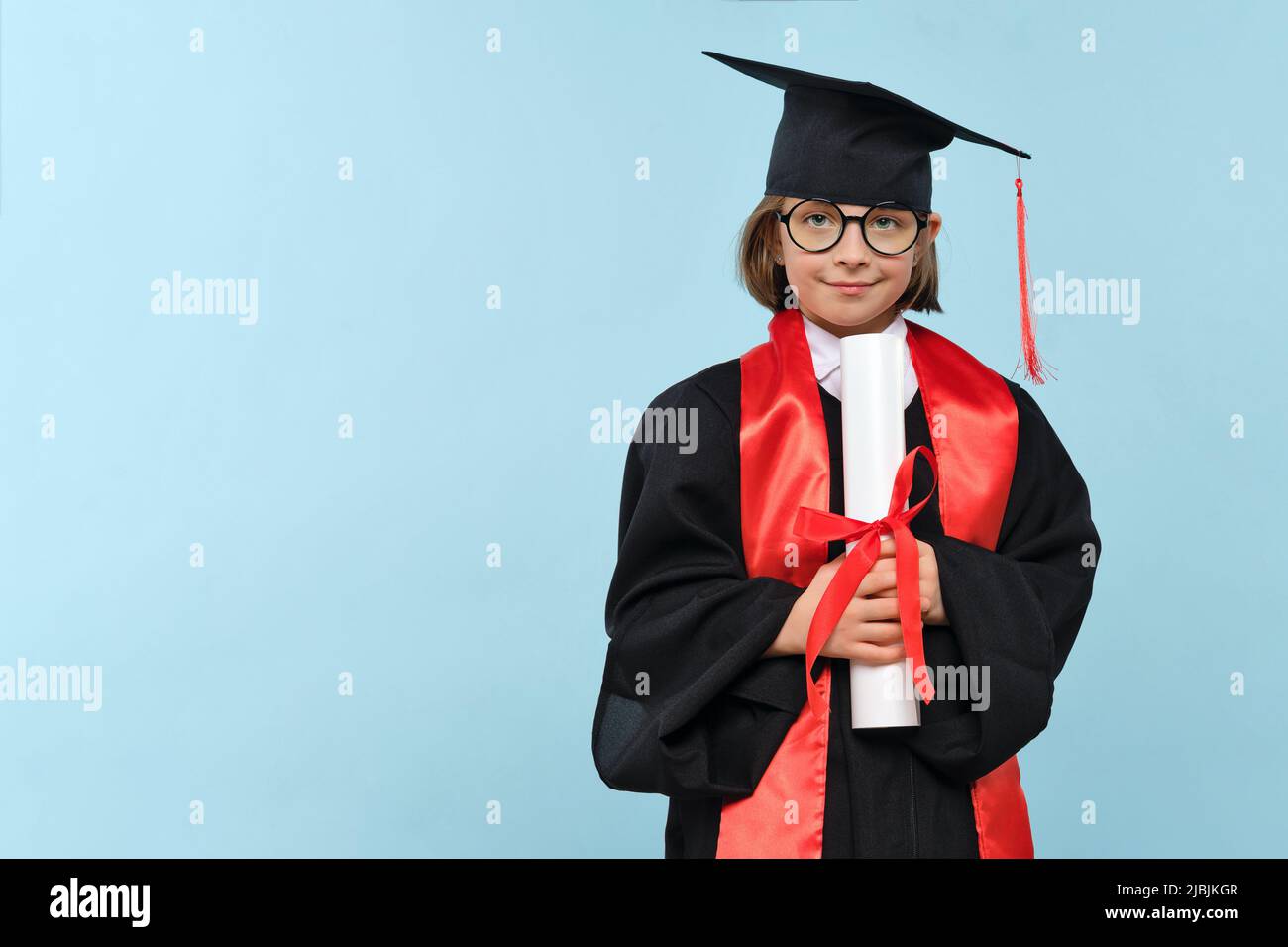 Whizz kid 9-11 year girl wearing graduation cap, round eyewear and ...
