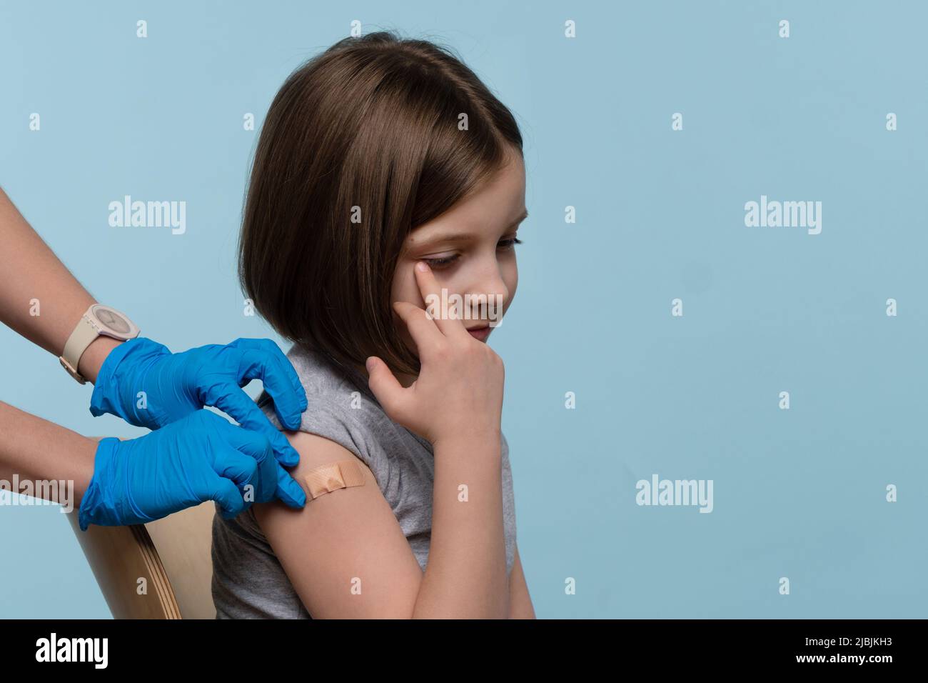 Child Getting Vaccinated Against Covid-19. Doctor Applying Plaster. Kid ...
